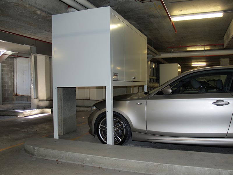 Car parked beneath over bonnet storage unit | Space Commander™
